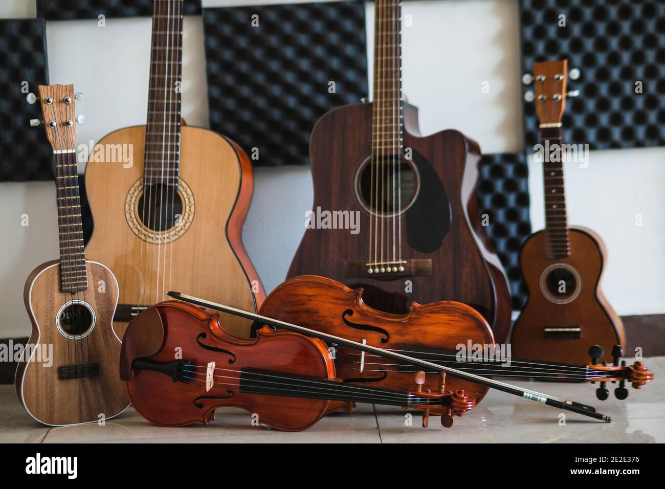 Row of different musical string instruments for a school of music Stock ...