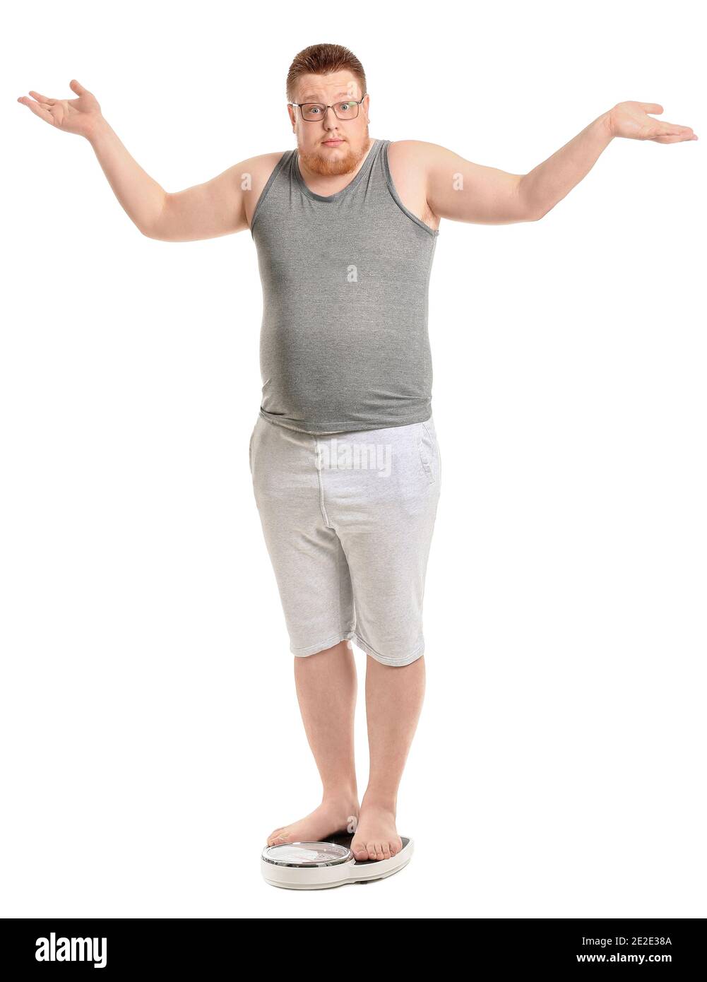 Confused overweight man with scales on white background. Weight loss ...