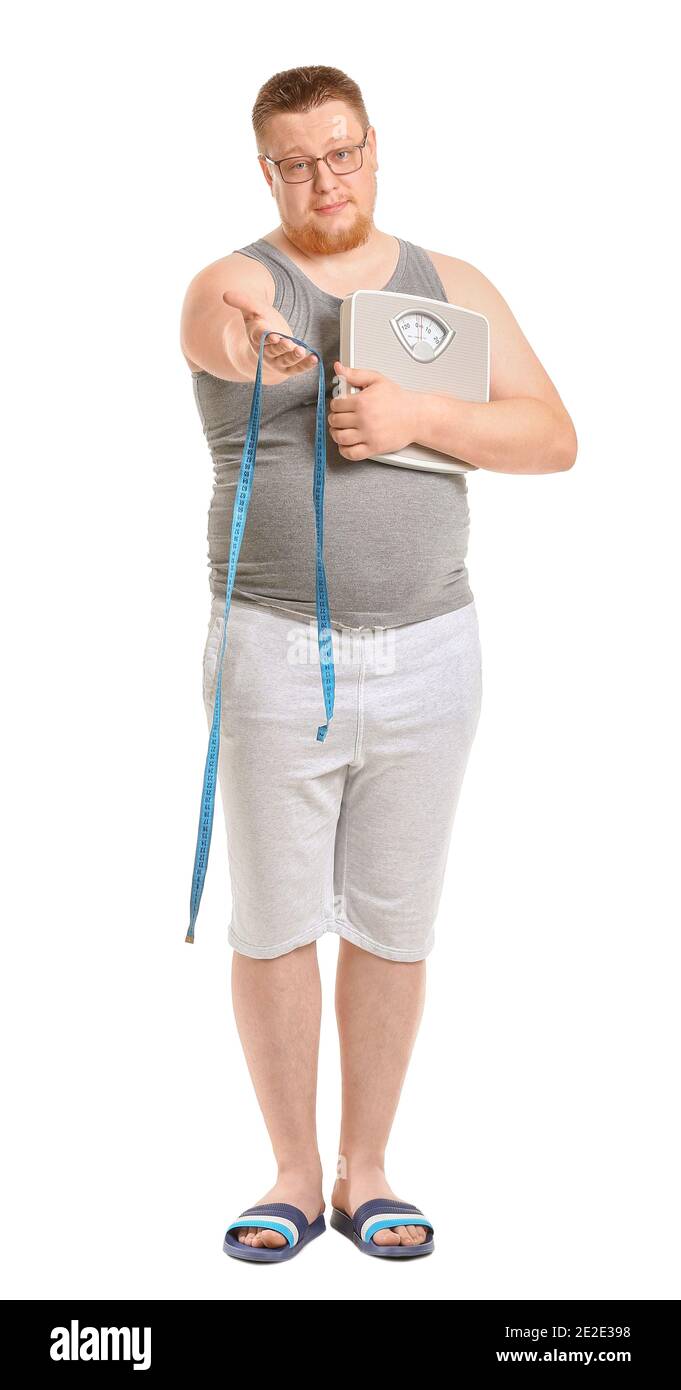 Overweight man with scales and measuring tape on white background ...