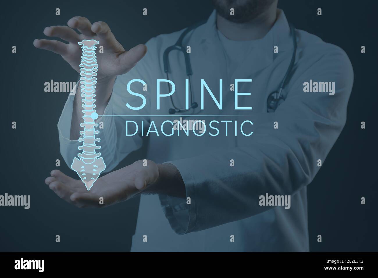 Male doctor with holographic projection of human spine on dark ...