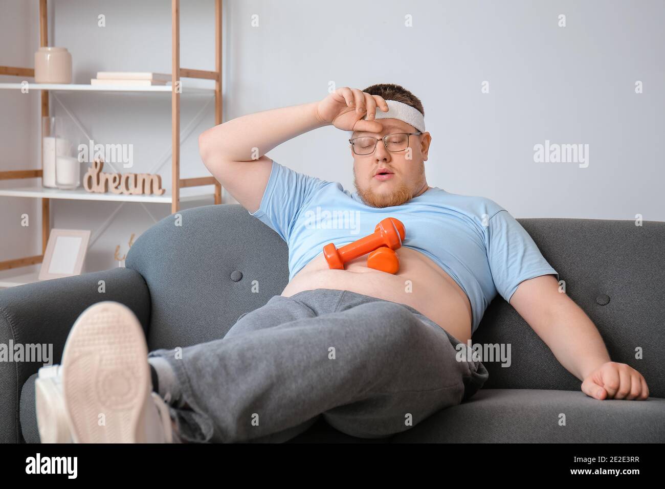 Fat man gym sofa hi-res stock photography and images - Alamy