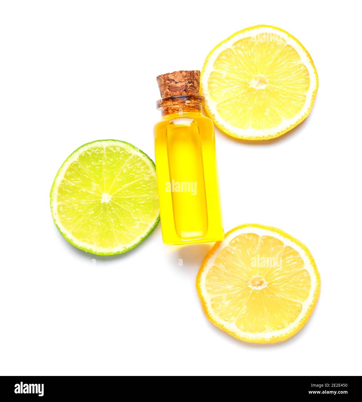 Bottle of lemon essential oil on white background Stock Photo - Alamy