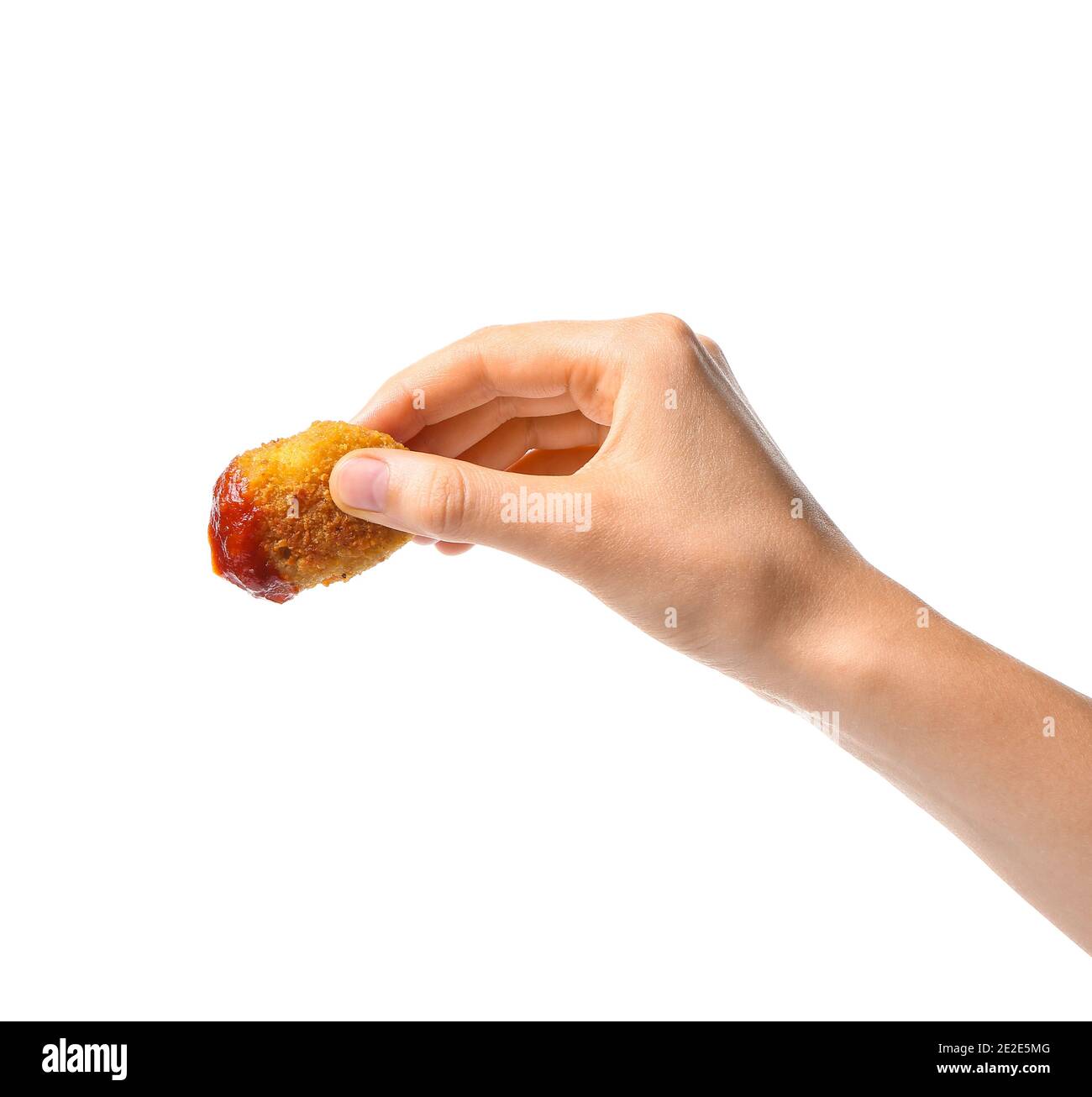 Female hand with tasty chicken nugget on white background Stock Photo ...