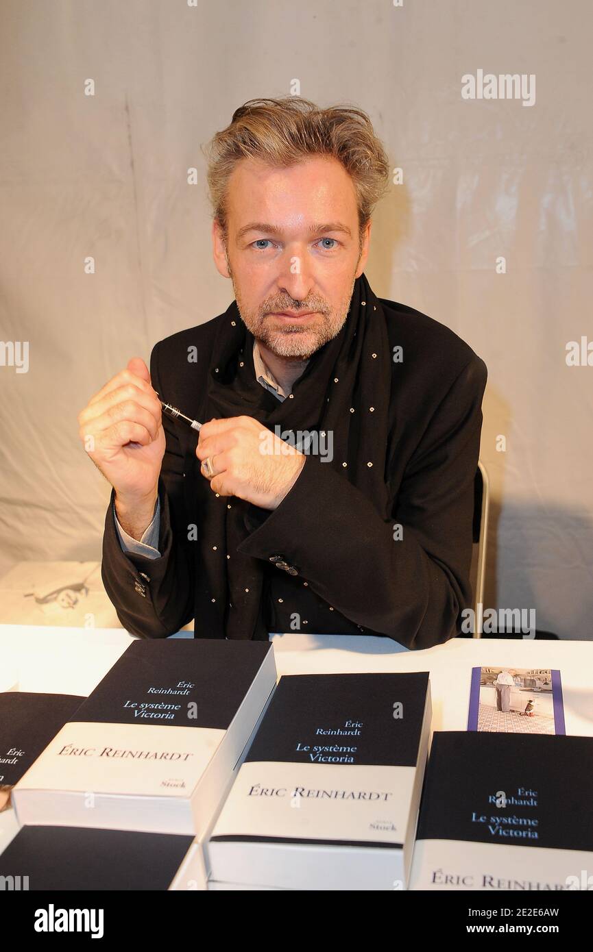 Eric Reinhardt signing copies of his book during 'Radio France Fete le ...