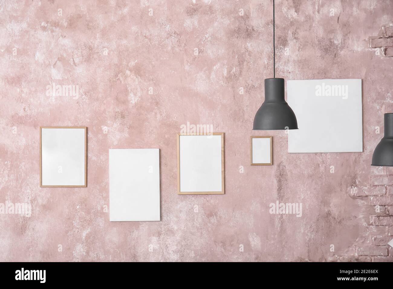 Blank posters on color wall Stock Photo - Alamy