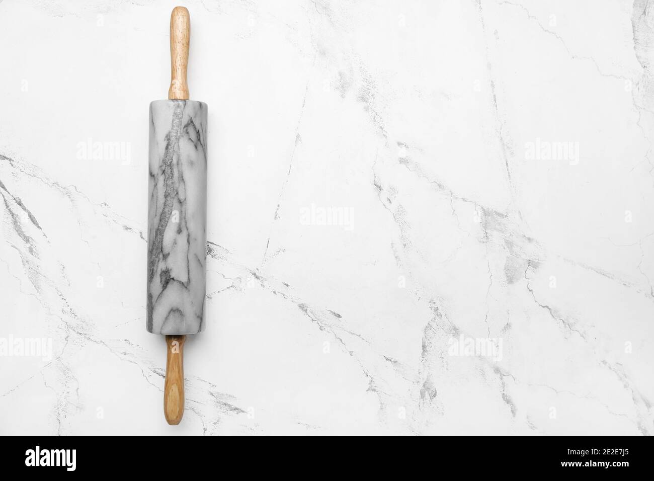 Marble rolling pin on light background Stock Photo - Alamy