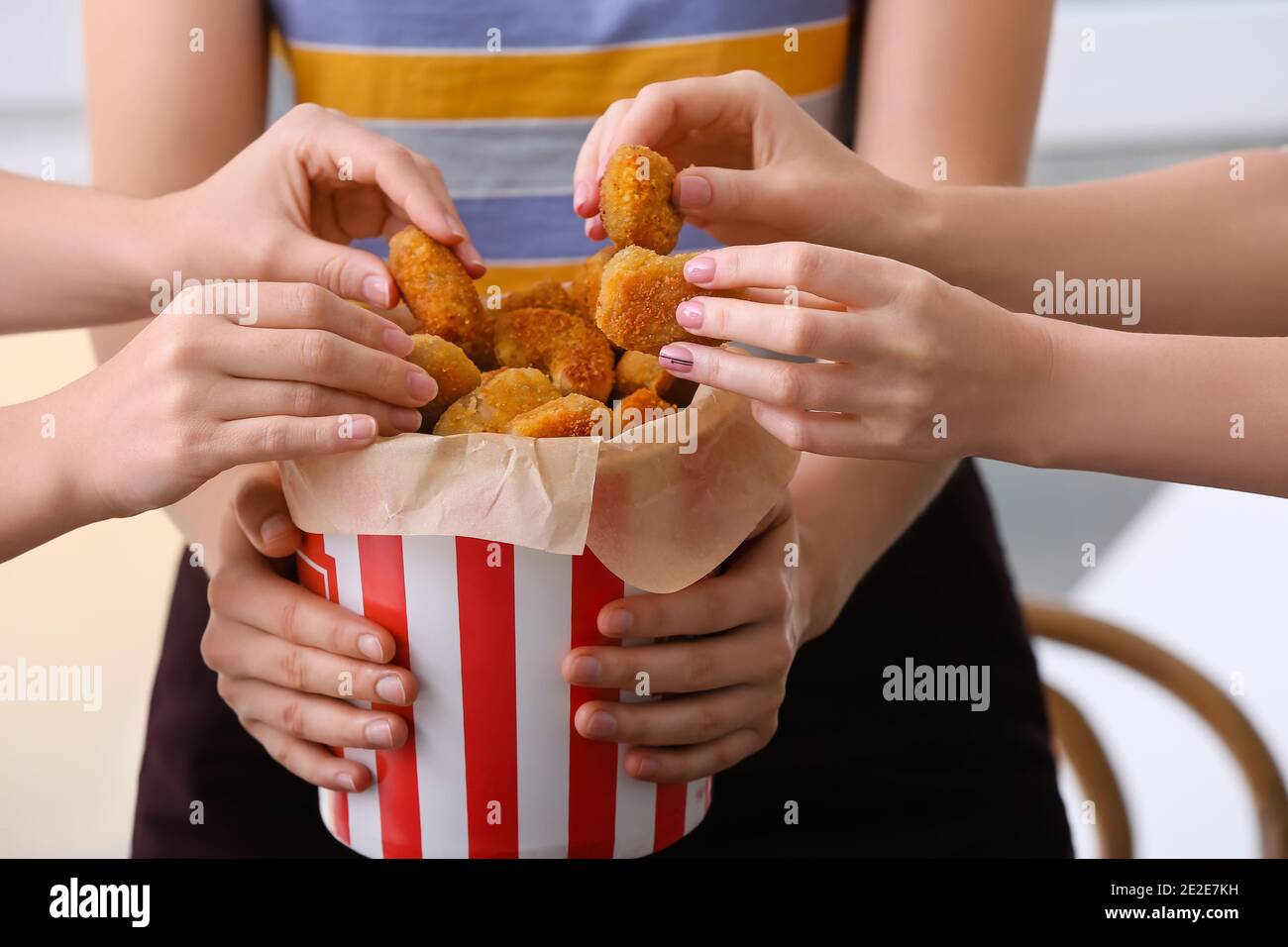 Holding Chicken Nuggets High Resolution Stock Photography and Images ...