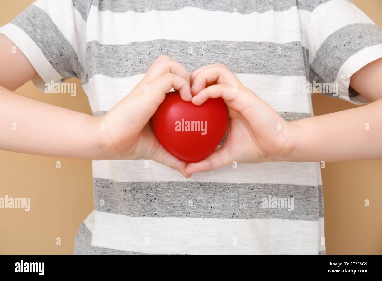 Child holding figure of heart Stock Photo - Alamy