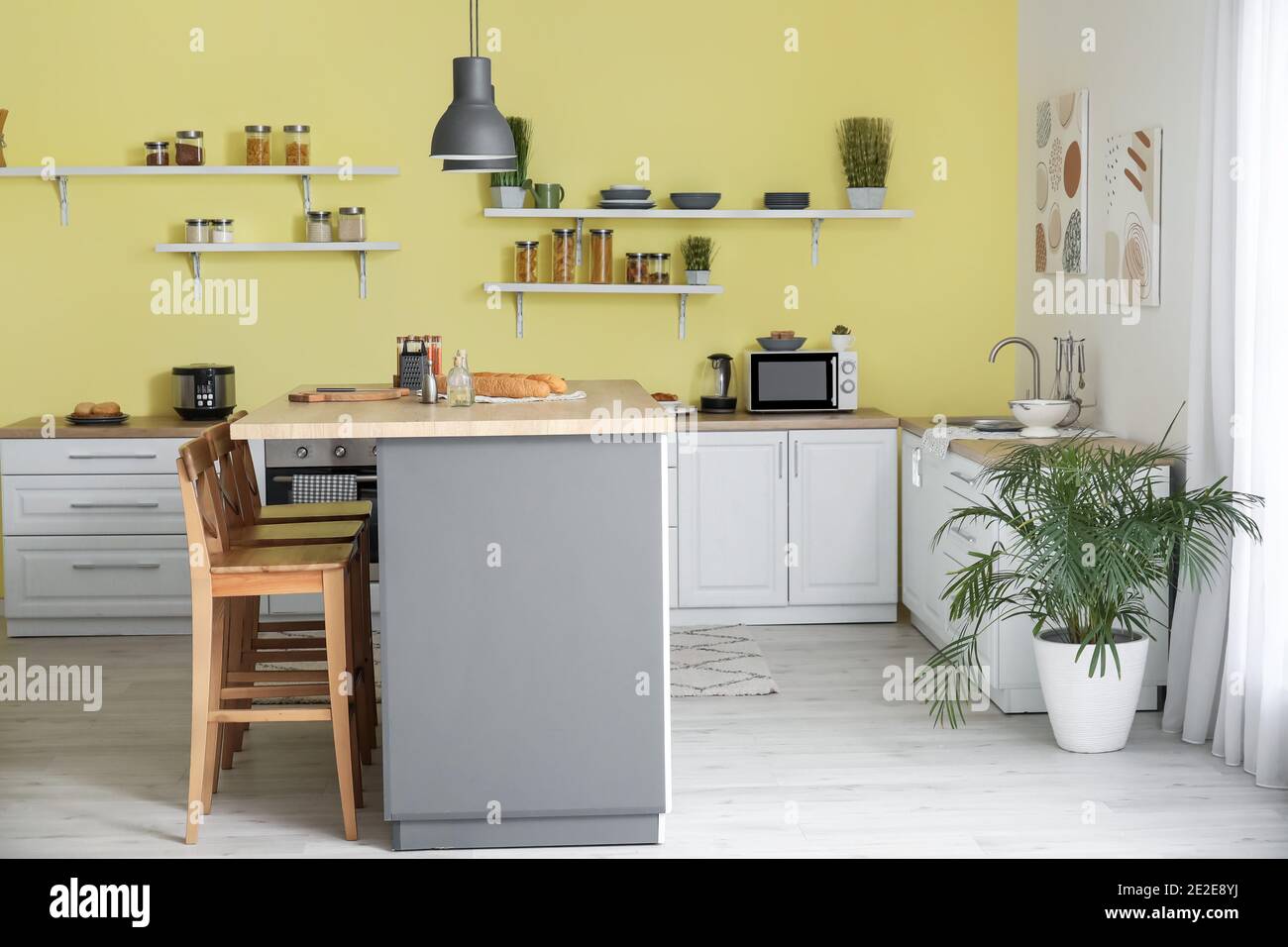 Interior of modern comfortable kitchen Stock Photo - Alamy