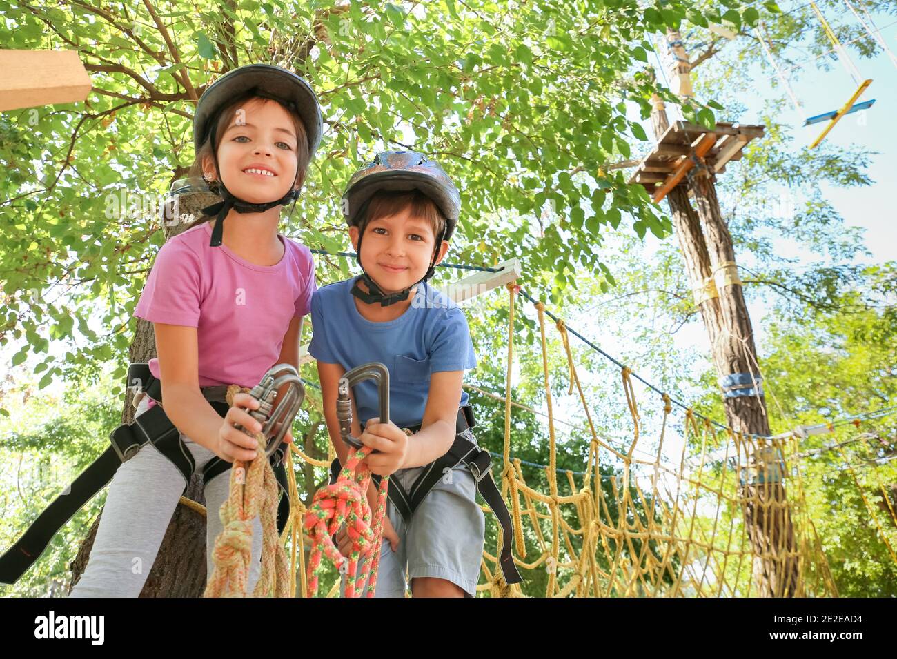 Children climbing in adventure park Stock Photo - Alamy