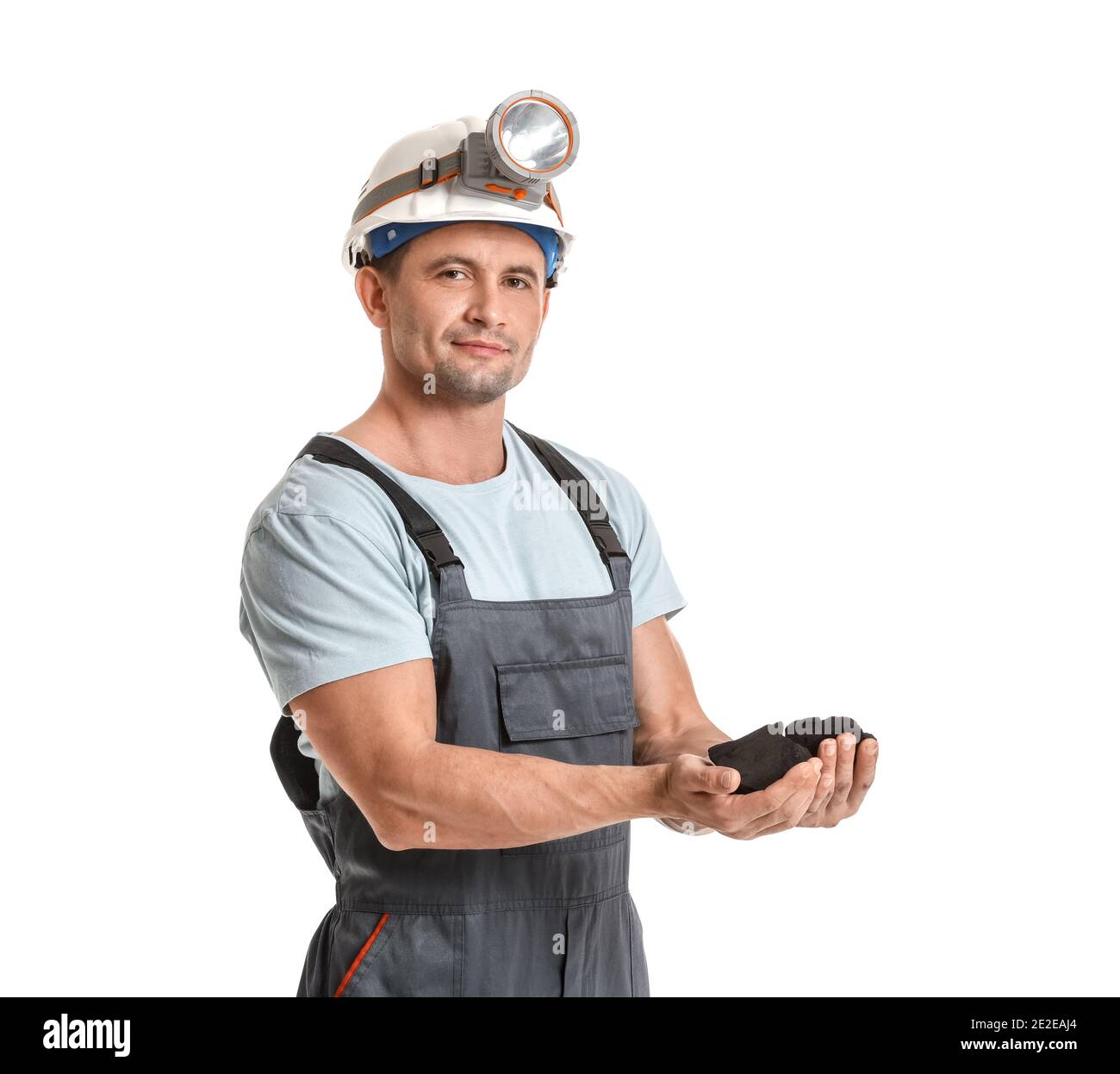 Miner man with coal on white background Stock Photo - Alamy