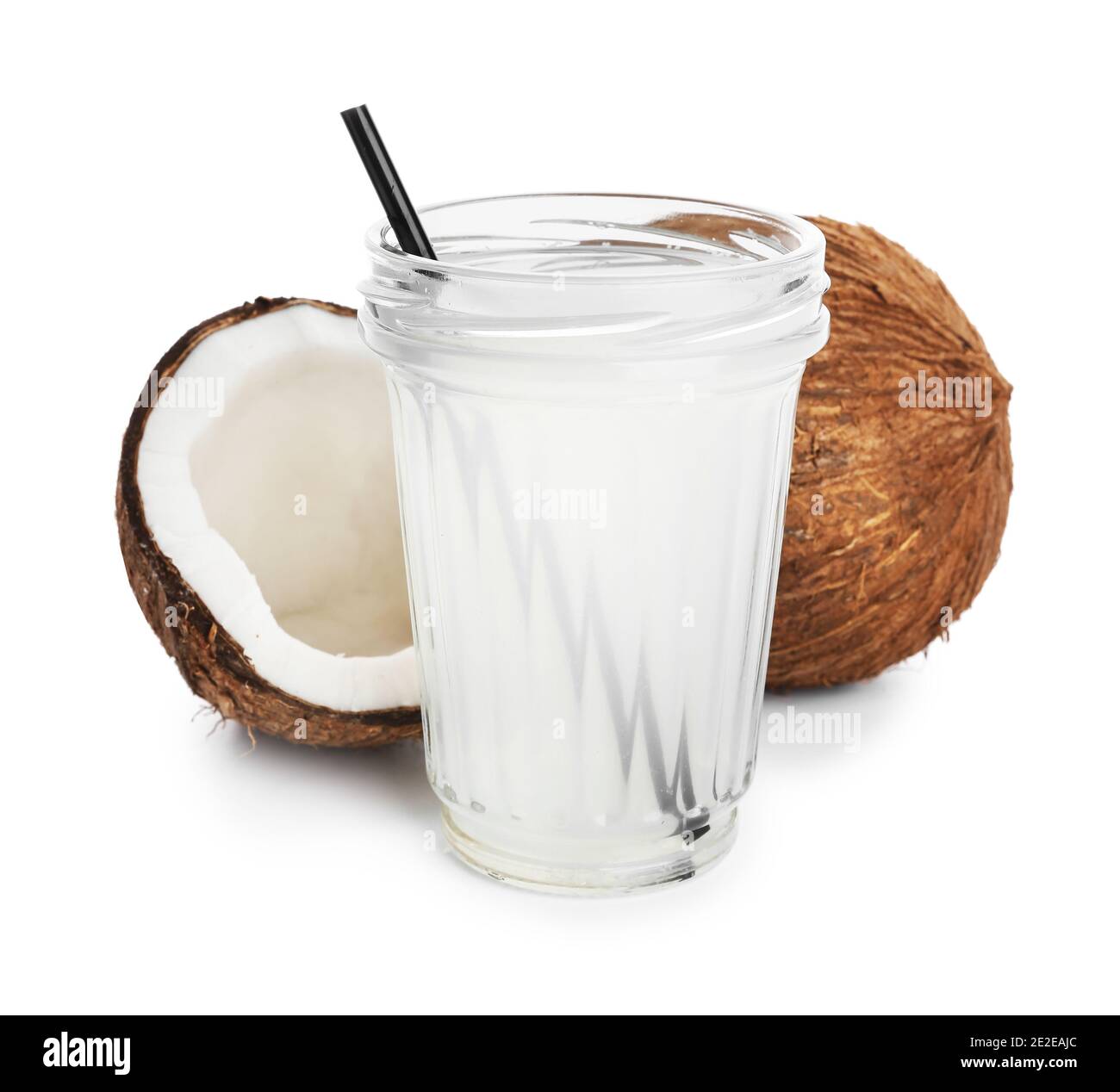 Glass of fresh coconut water on white background Stock Photo - Alamy