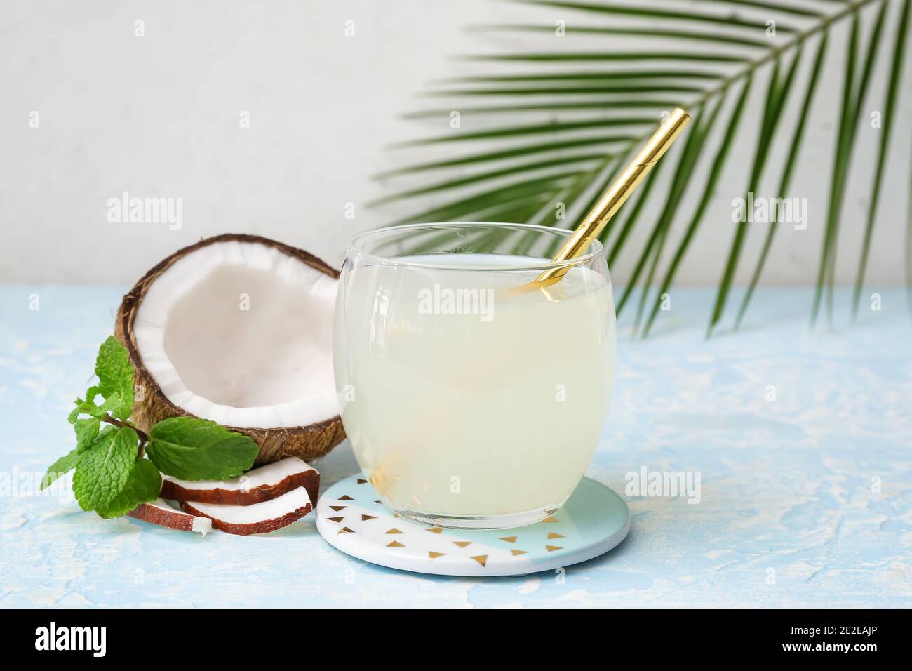 Glass of fresh coconut water on table Stock Photo - Alamy