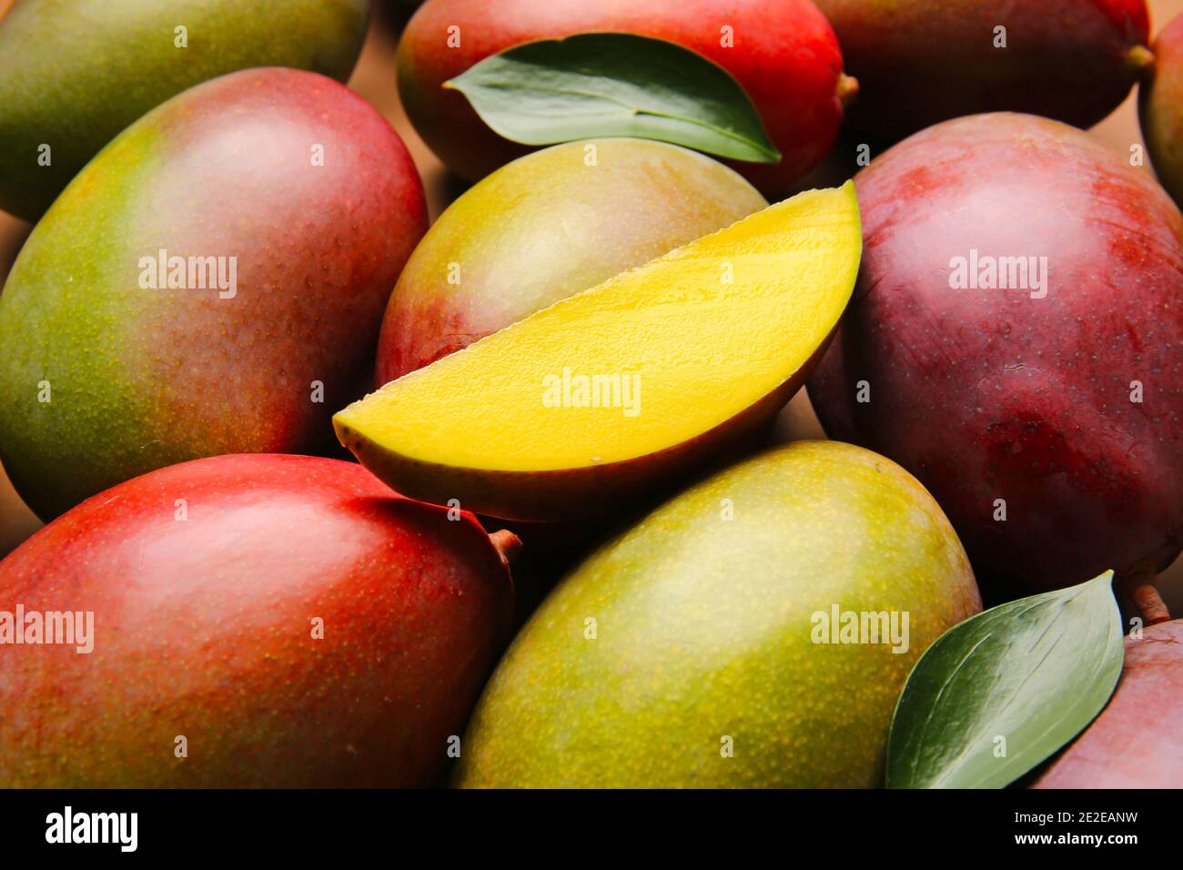 Many ripe mangoes as background Stock Photo - Alamy