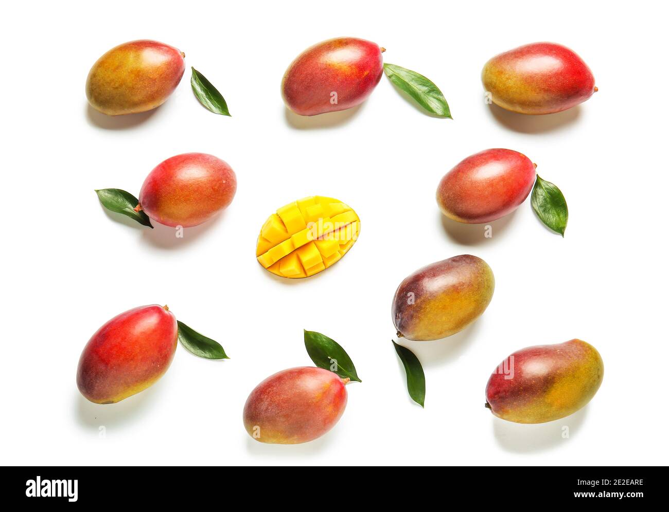 Composition with sweet ripe mangoes on white background Stock Photo - Alamy