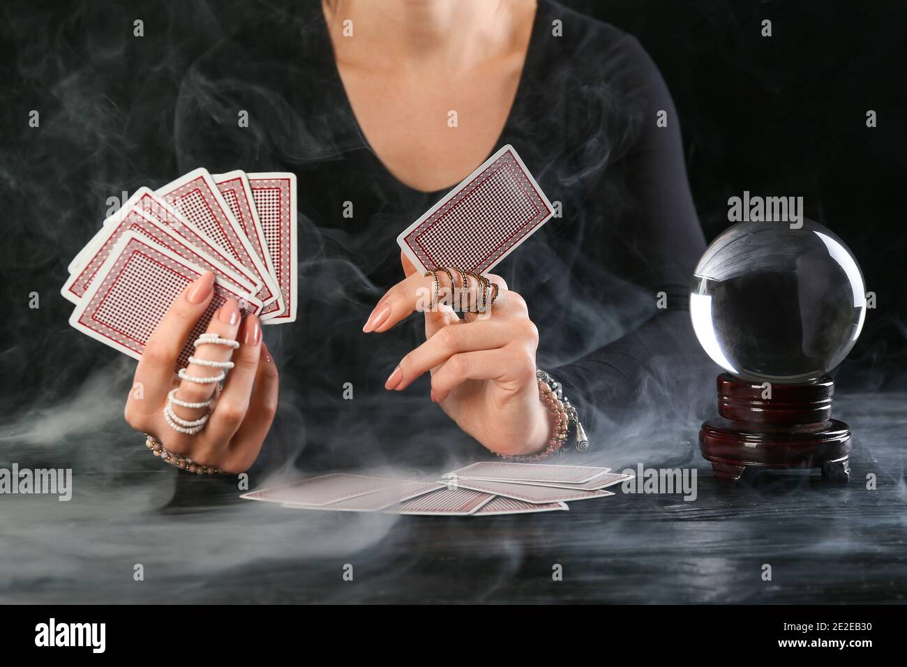 Fortune teller with cards reading future at table Stock Photo - Alamy