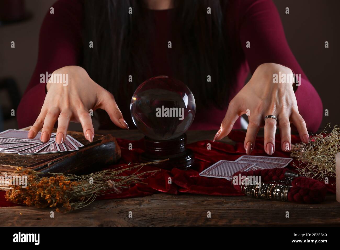 Fortune teller with crystal ball reading future at table Stock Photo ...