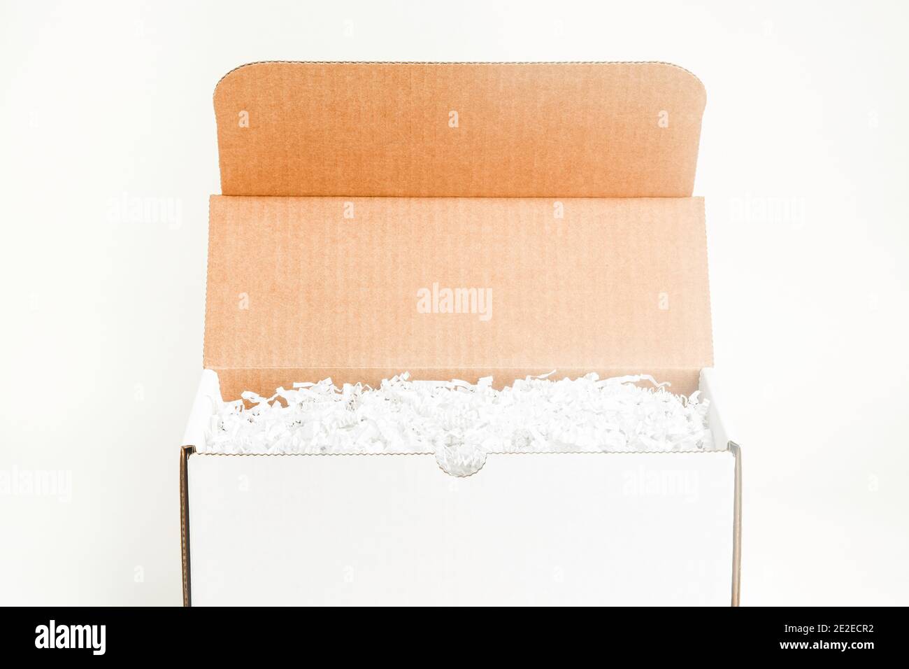 An open white rectangular cardboard packaging box set on plain white ...