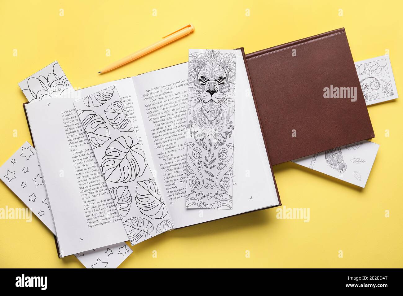 Cute bookmarks with books on color background Stock Photo - Alamy