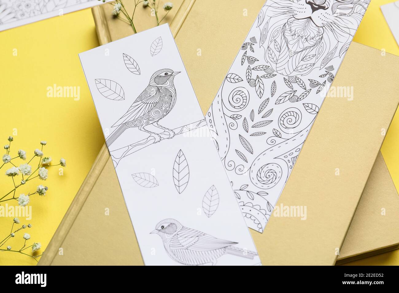 Cute bookmarks with books on color background Stock Photo - Alamy