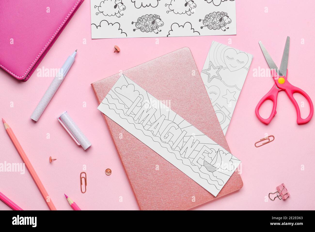 Cute bookmarks with stationery on color background Stock Photo - Alamy