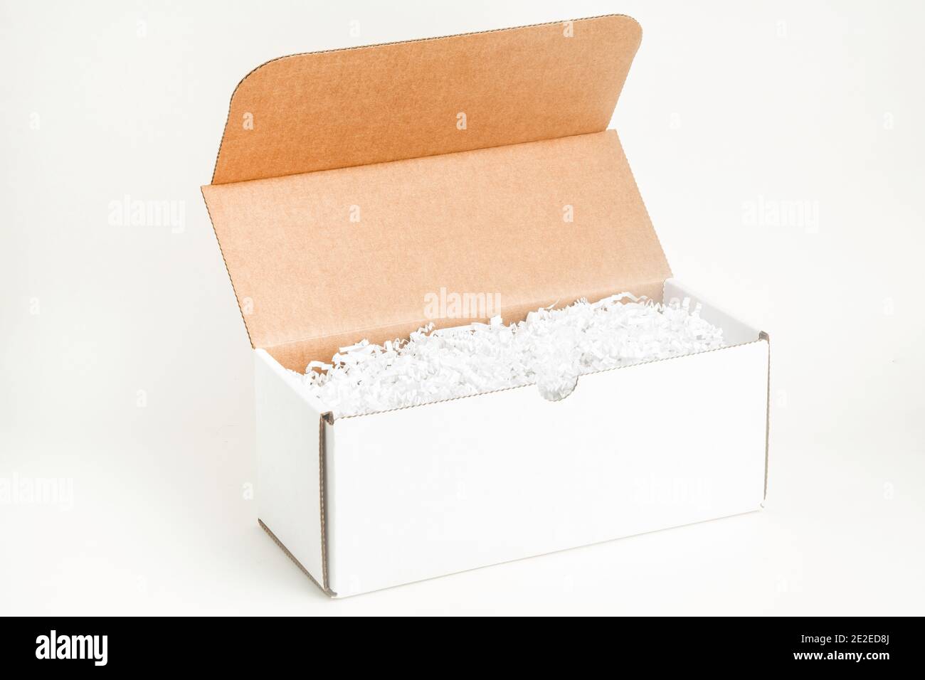 An open white rectangular cardboard packaging box set on plain white ...