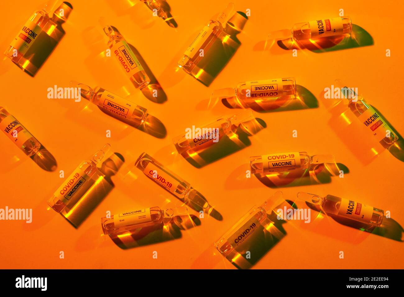 Vaccine for immunization against COVID-19 on color background Stock ...