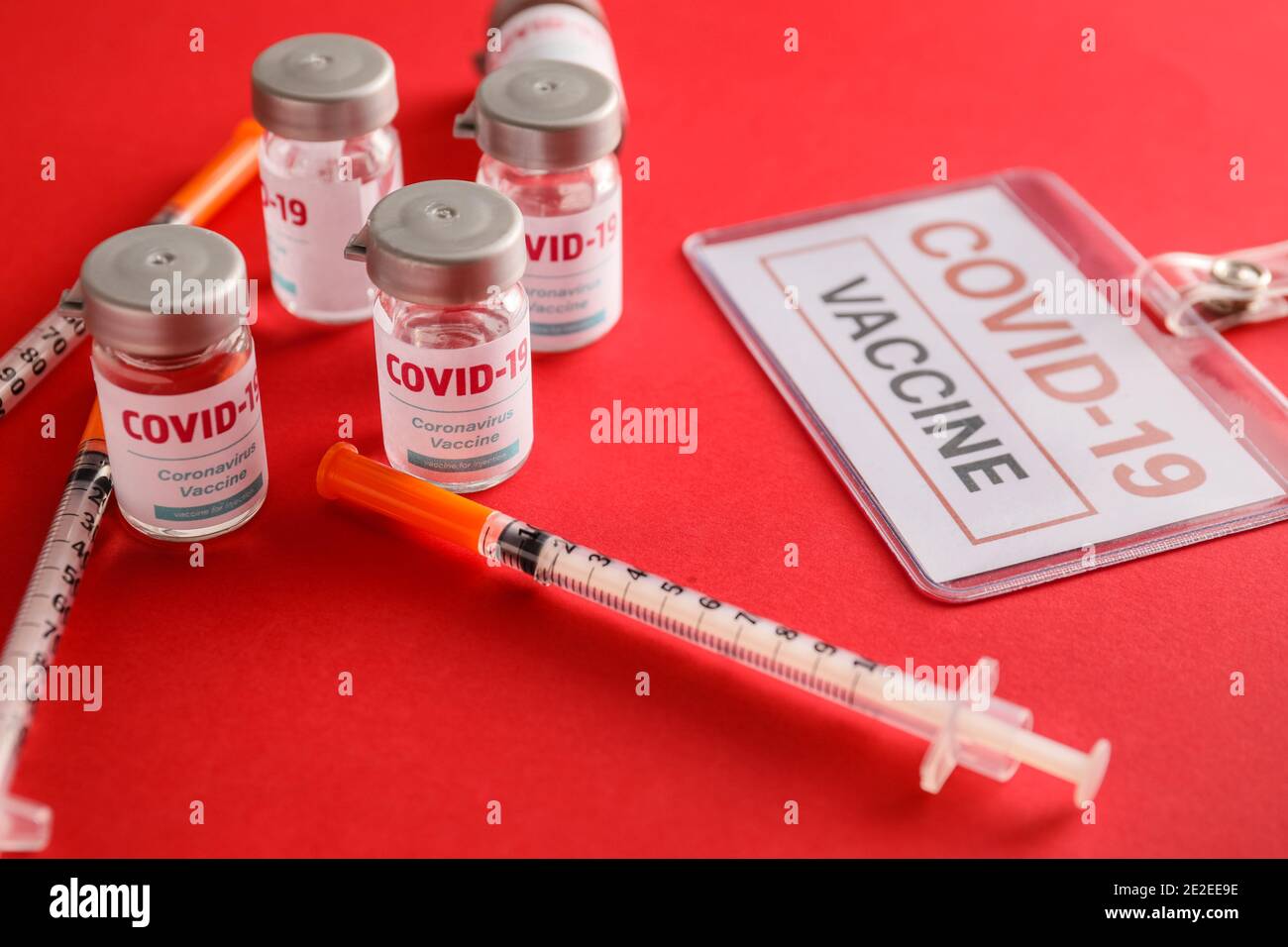 Vaccine for immunization against COVID-19 on color background Stock ...