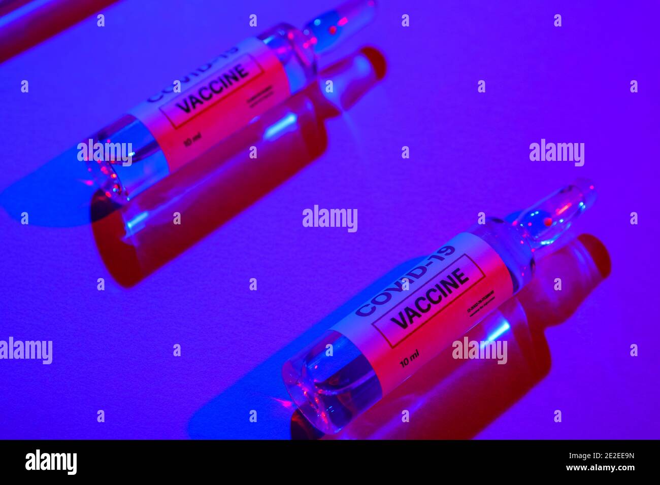 Vaccine for immunization against COVID-19 on color background Stock ...