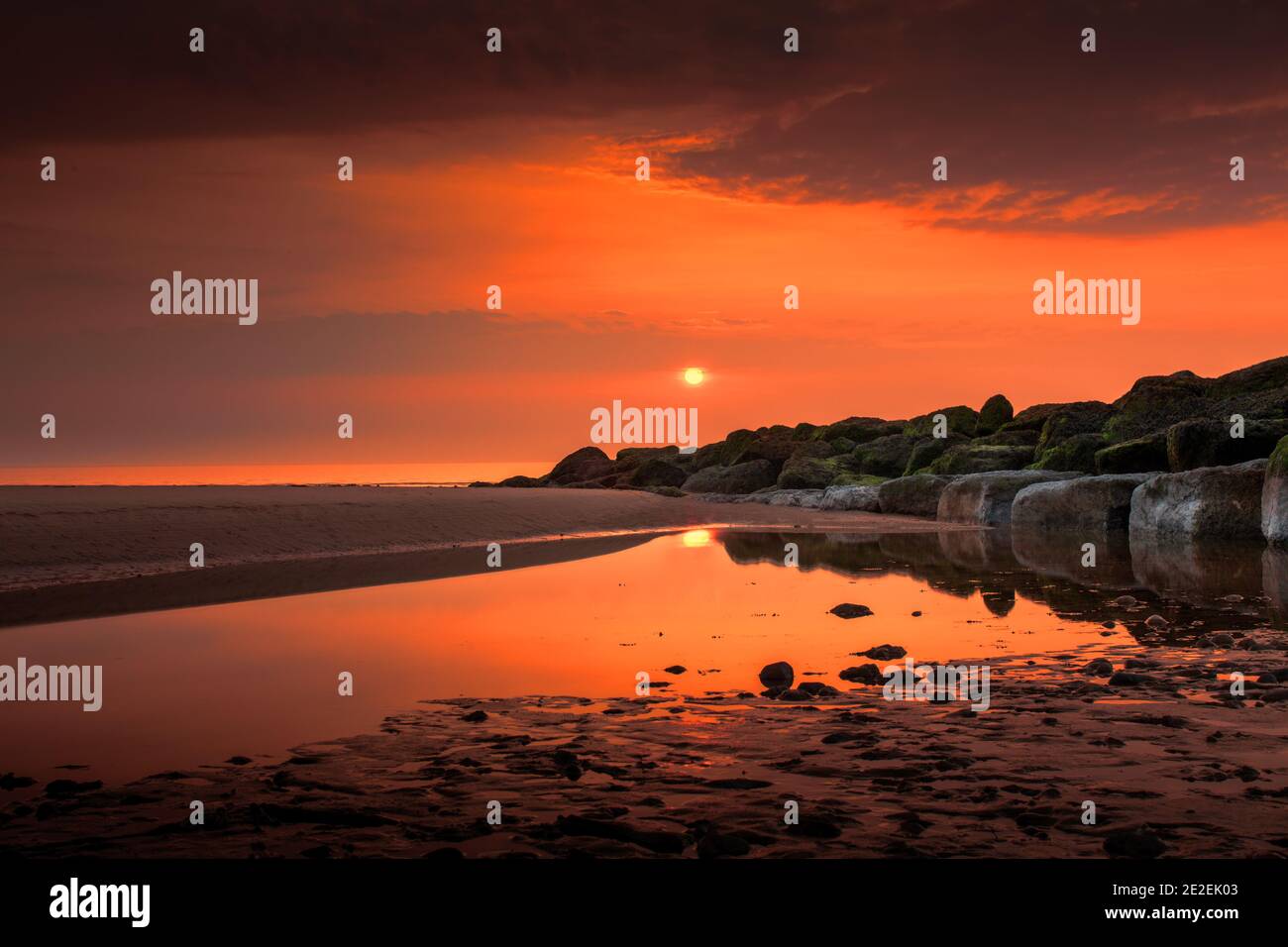 Sunset at the beach Stock Photo - Alamy