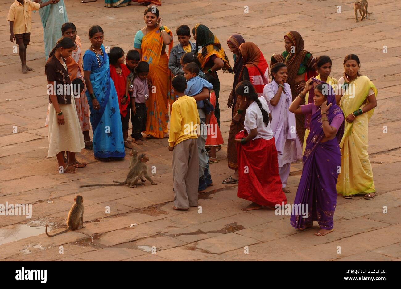 Group of Indians and a few monkeys, Badami.Badami, the ancient Vatapi ...