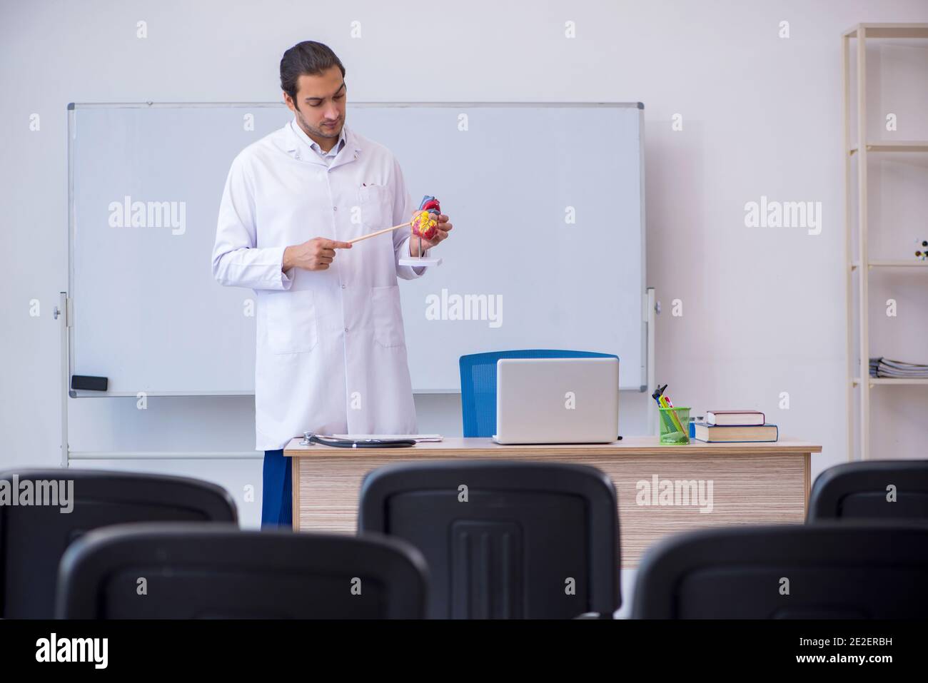 Young doctor cardiologist giving seminar in the classroom Stock Photo ...