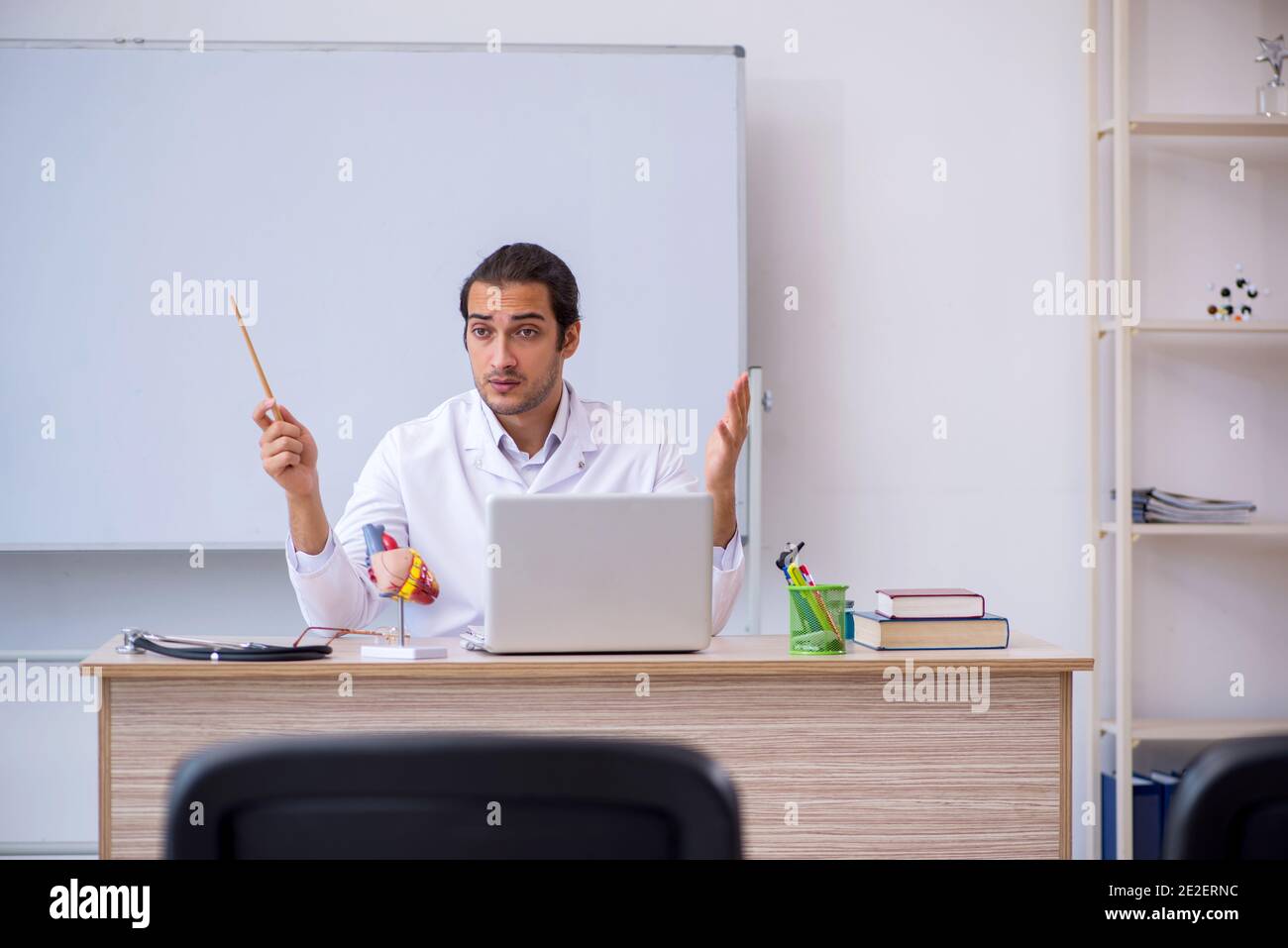 Young doctor giving seminar in the classroom Stock Photo - Alamy