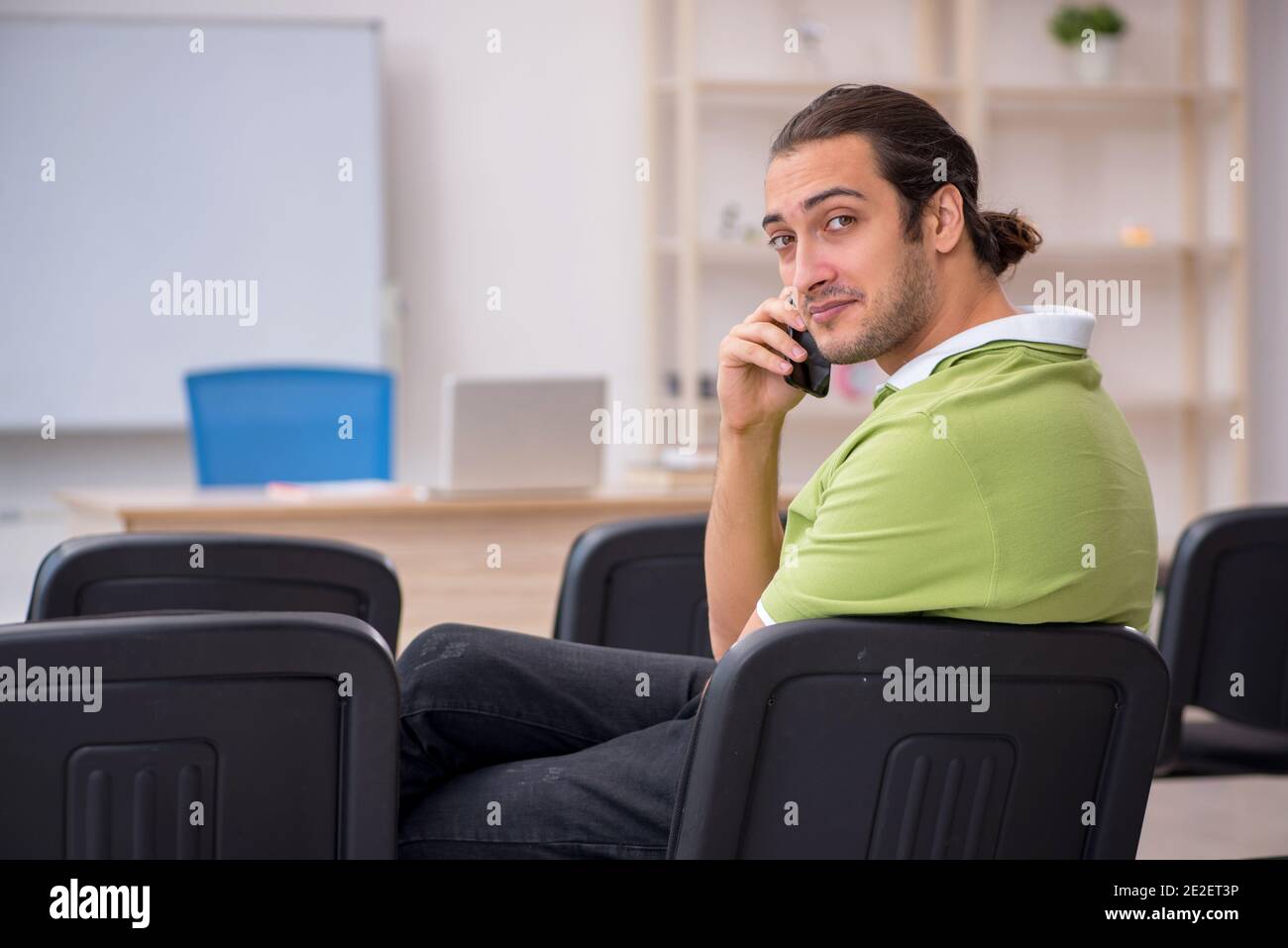 Young student in business presentation concept Stock Photo - Alamy