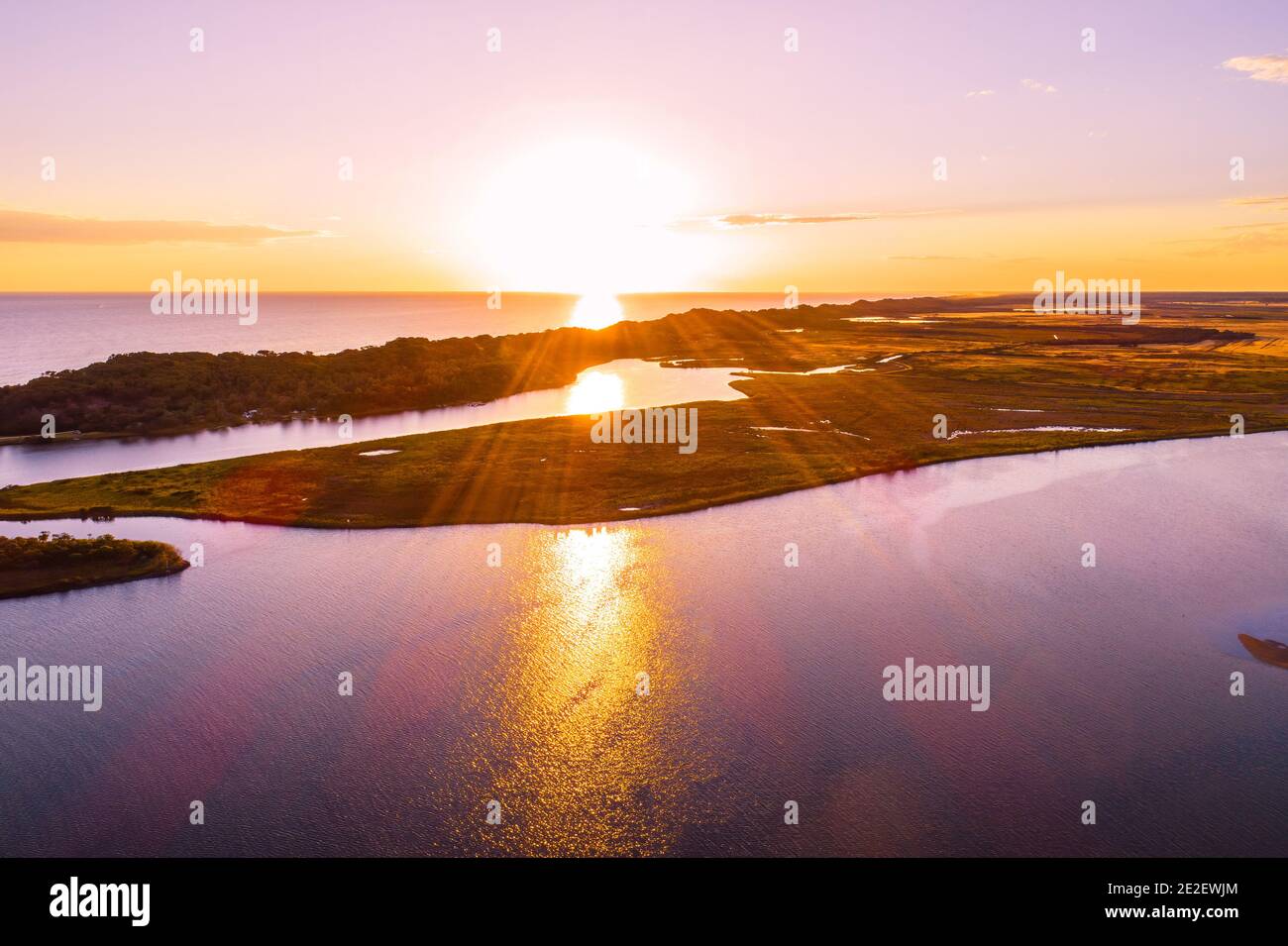 Amazing sunset over ocean coastline - aerial view with lens flare Stock ...