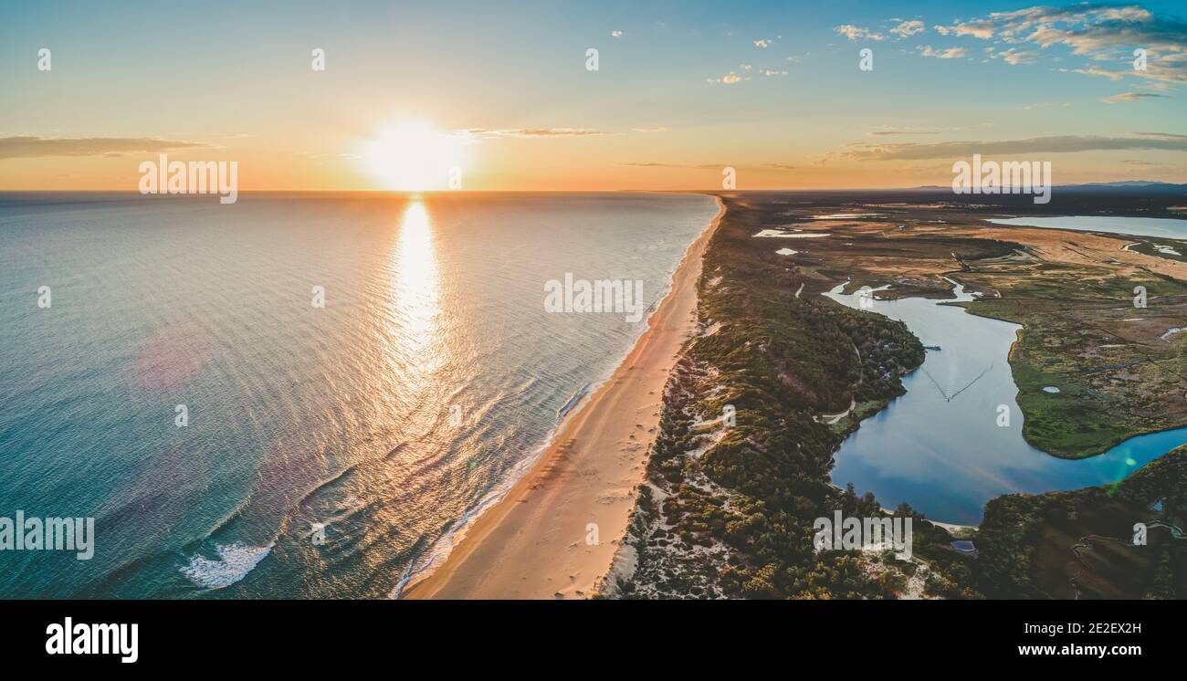 Scenic sunset over ocean beach in Australia - aerial panorama Stock ...