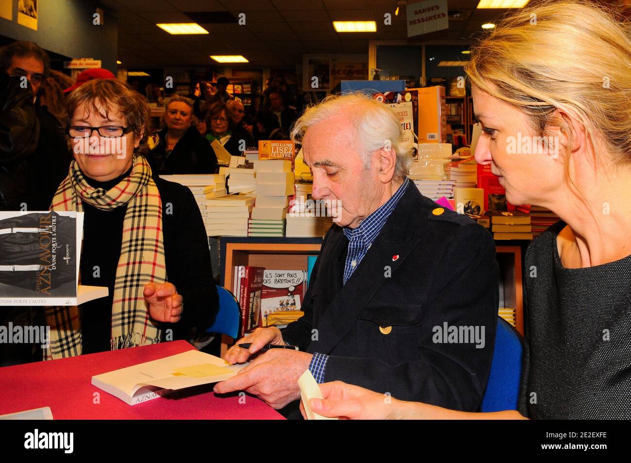 Singer Charles Aznavour signs copies of his new book 'D'Une Porte A L ...
