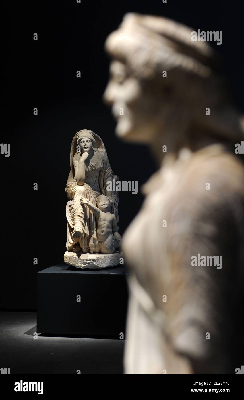 Statue of a female deity flanked by a triton at the Massimo Museum in ...
