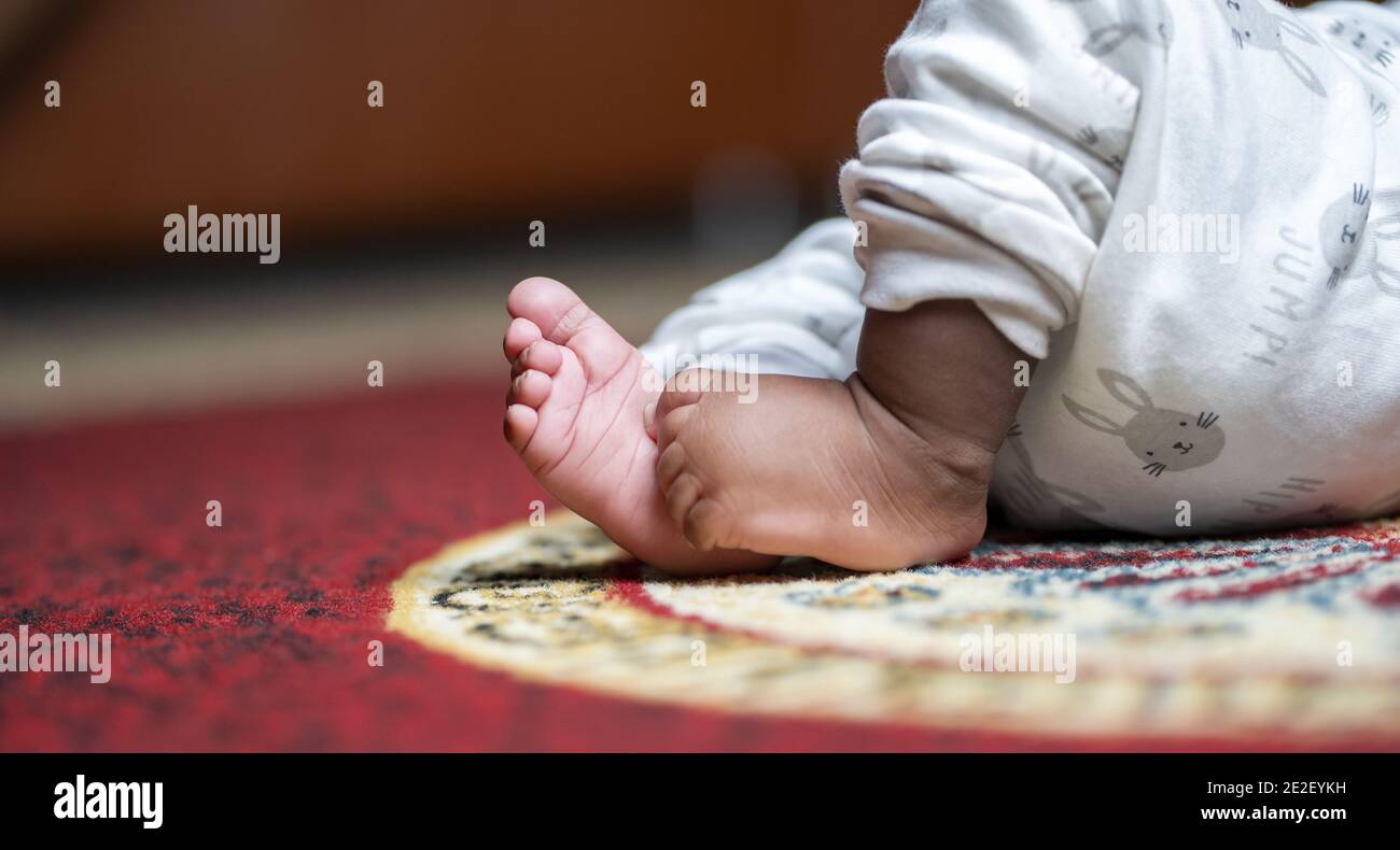 Curled up feet hi-res stock photography and images - Alamy