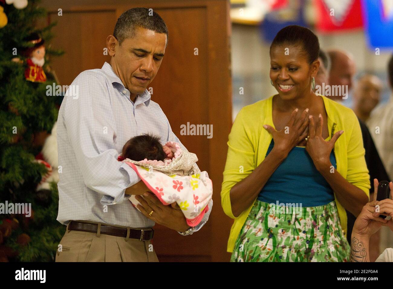 President Barack Obama holds one month old Adeline Valentina Hernandez ...