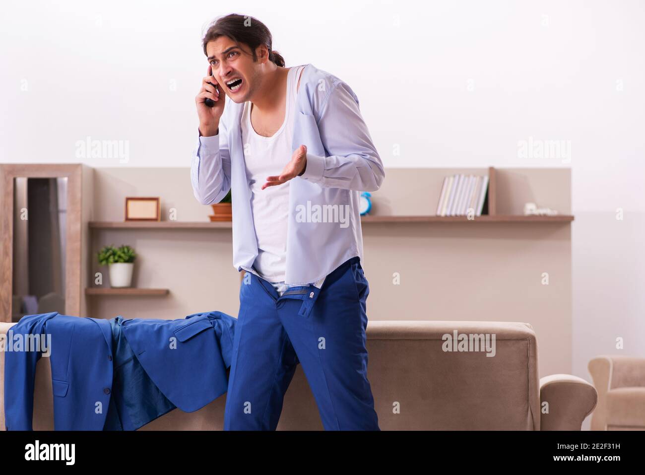 Getting angry with smartphone hi-res stock photography and images - Alamy