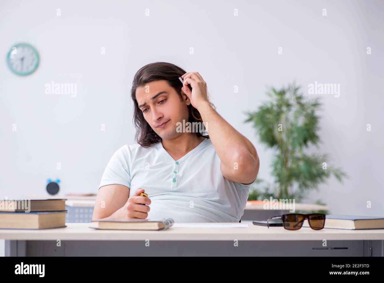 Male student smoking cigarettes in the classroom Stock Photo - Alamy