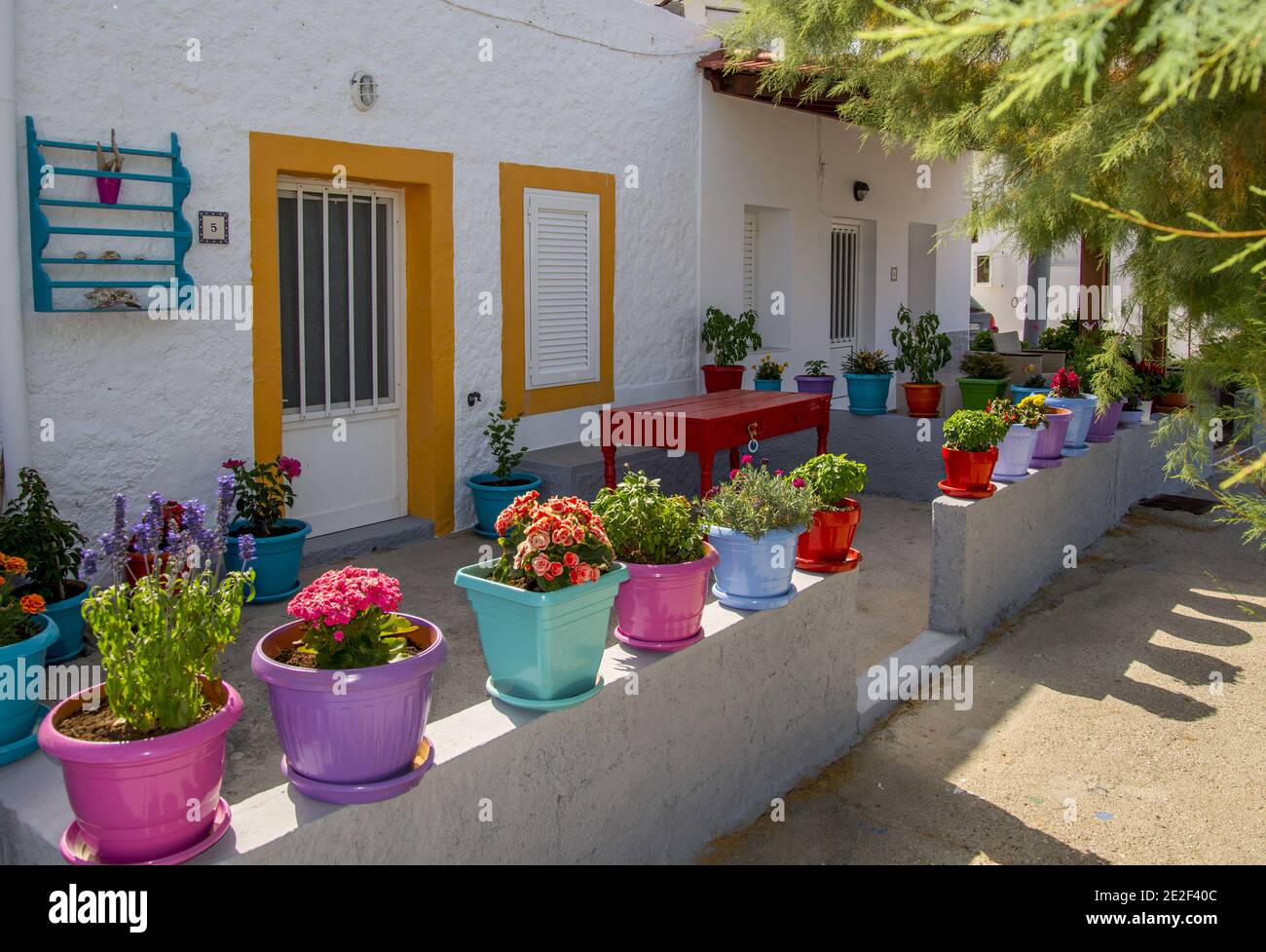 Colorful flower pots in the front yard of a beautiful house Stock Photo ...