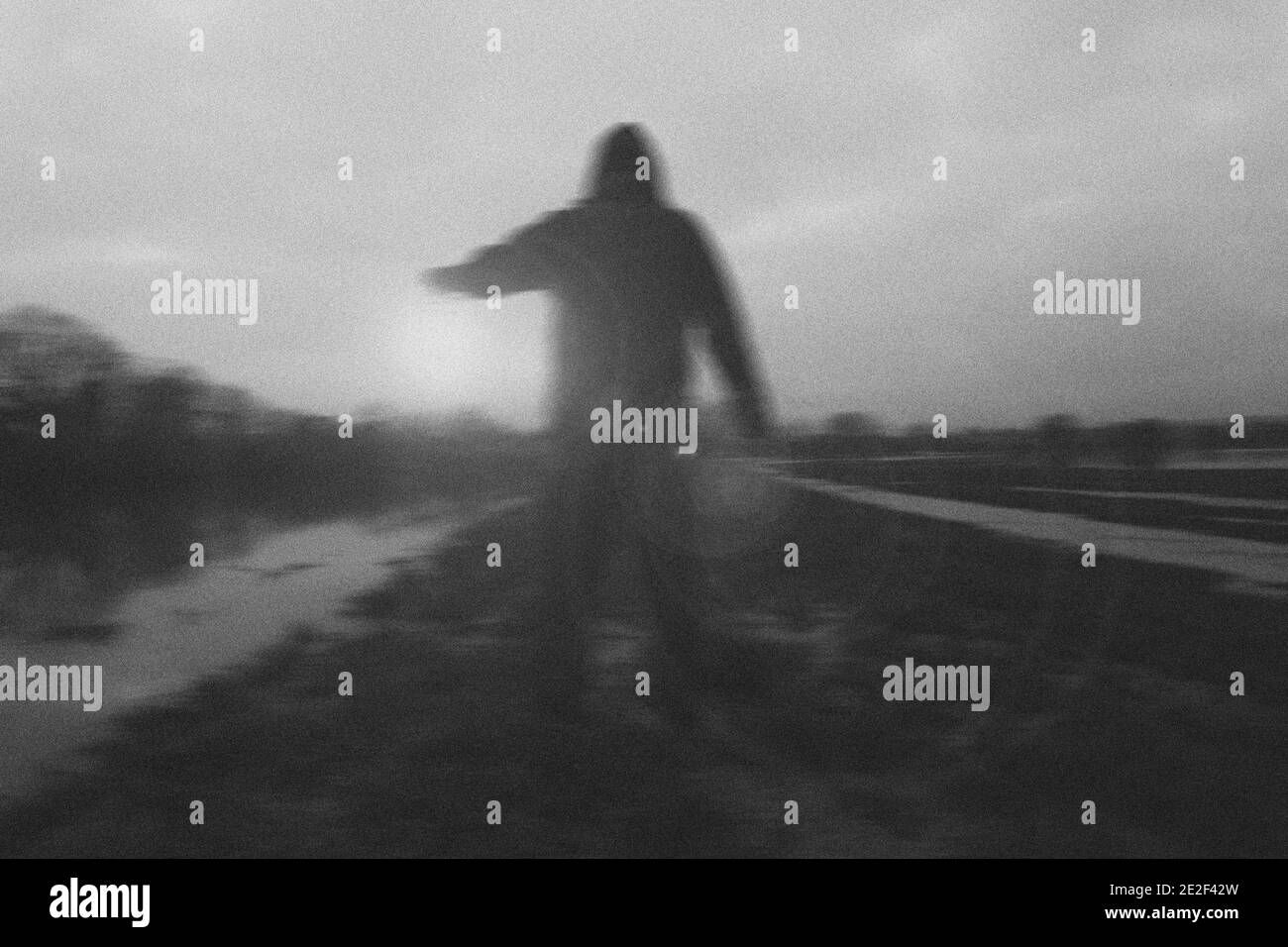 A moody dream like concept of a dark figure holding a lamp, back to ...