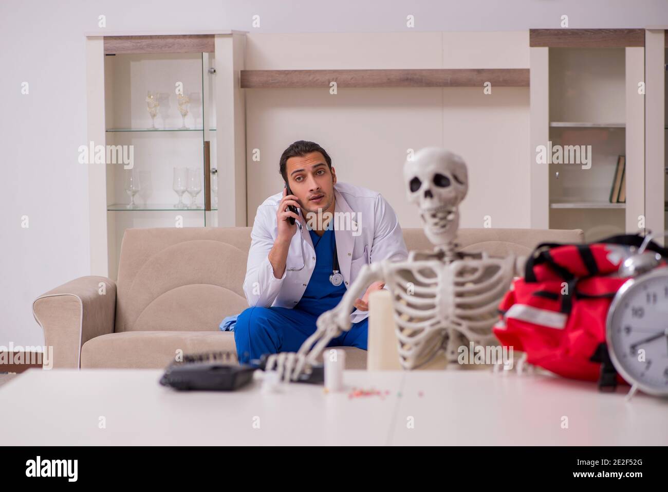 Male paramedic visiting skeleton patient Stock Photo - Alamy