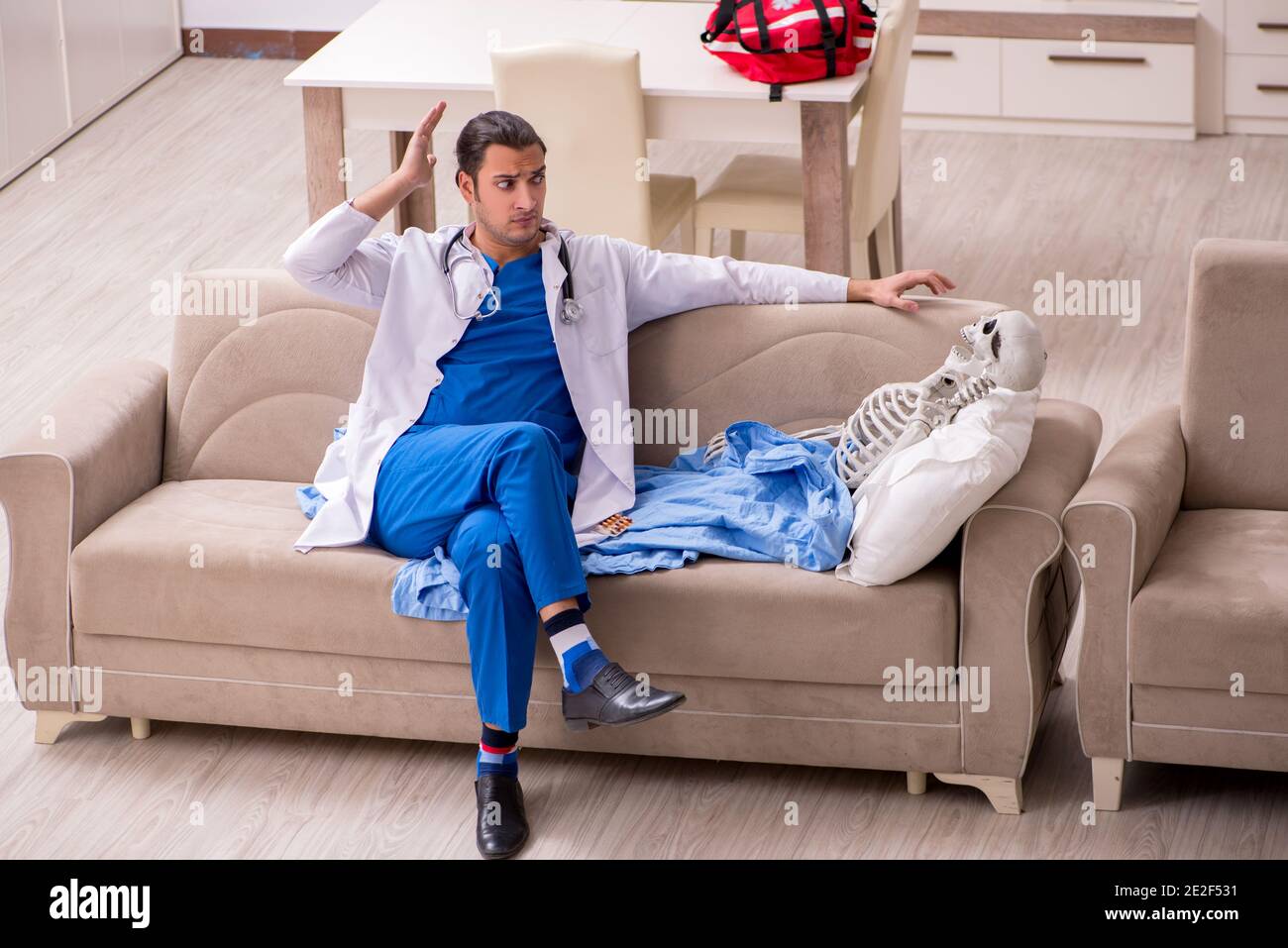 Male paramedic visiting skeleton patient Stock Photo - Alamy