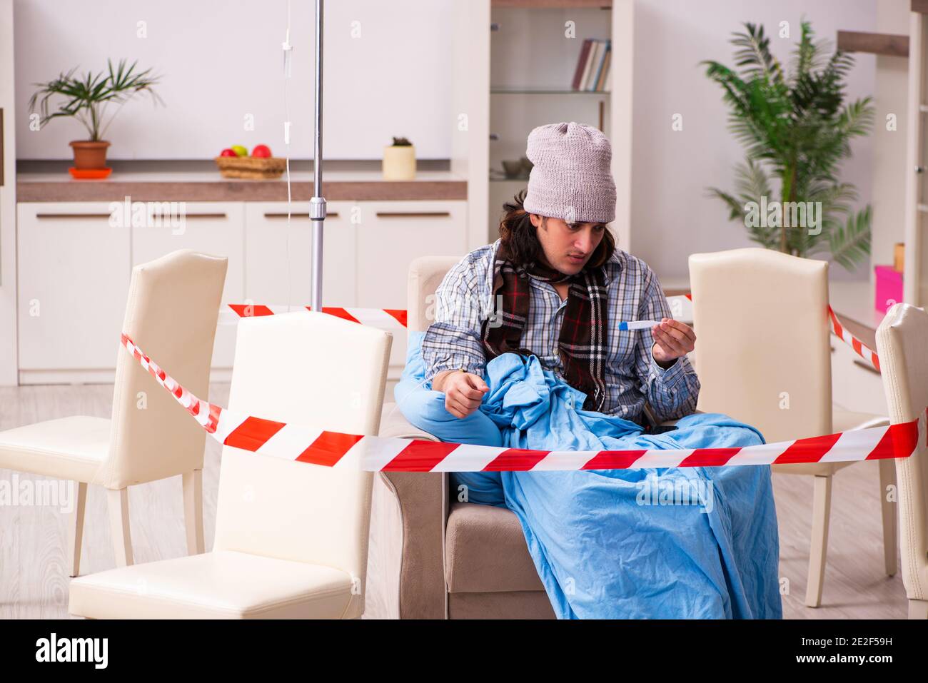 Sick man suffering at home in pandemic concept Stock Photo - Alamy