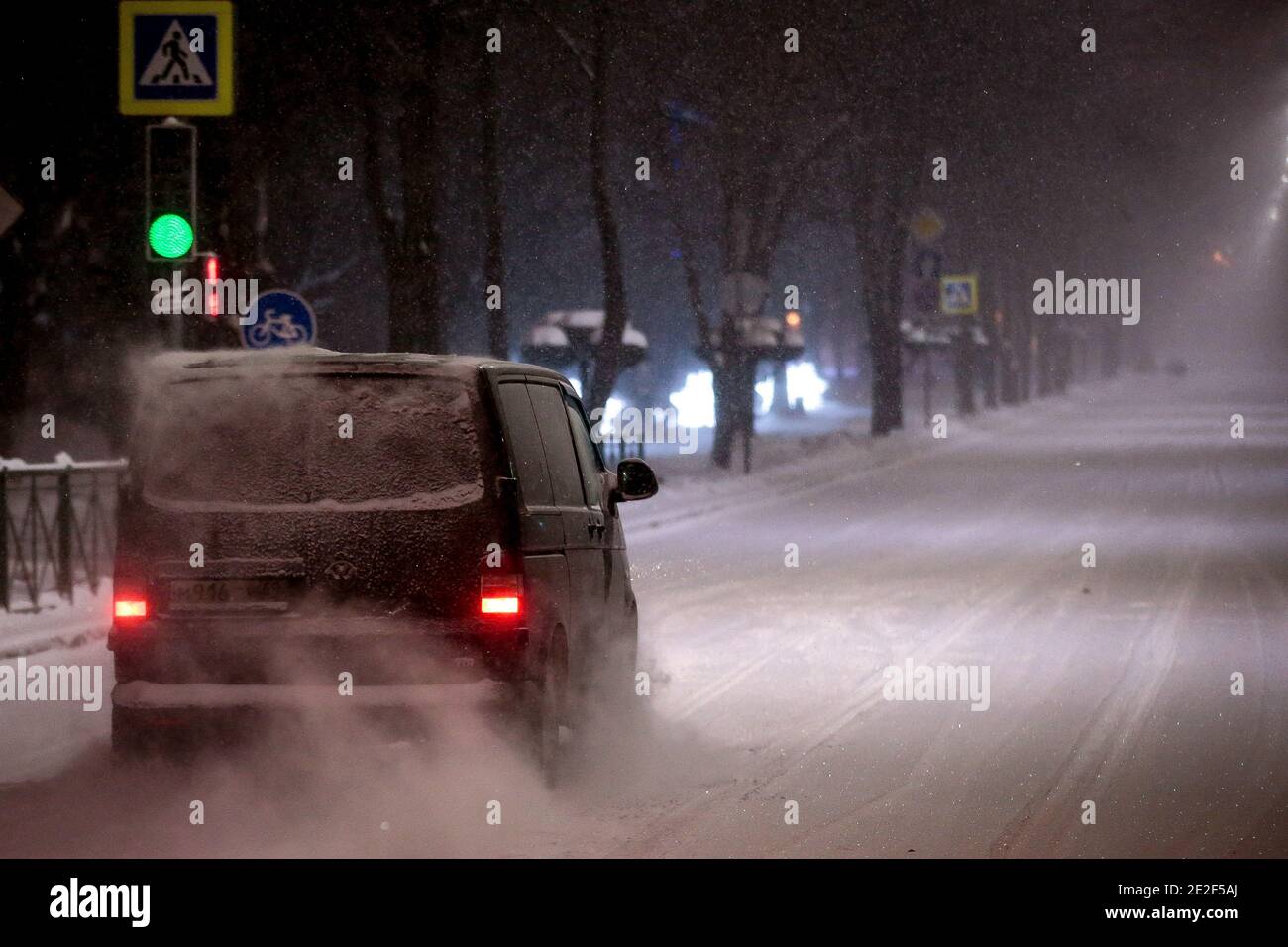 Heavy snowfall in Moscow, Russia. Car in traffic heacy snowfall Stock ...