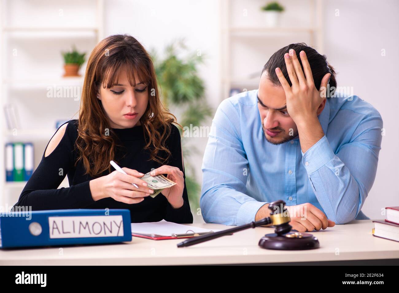 Couple divorcing in alimony concept Stock Photo - Alamy
