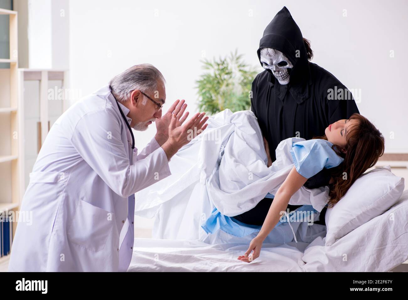 Devil, old doctor and female patient in clinic Stock Photo - Alamy
